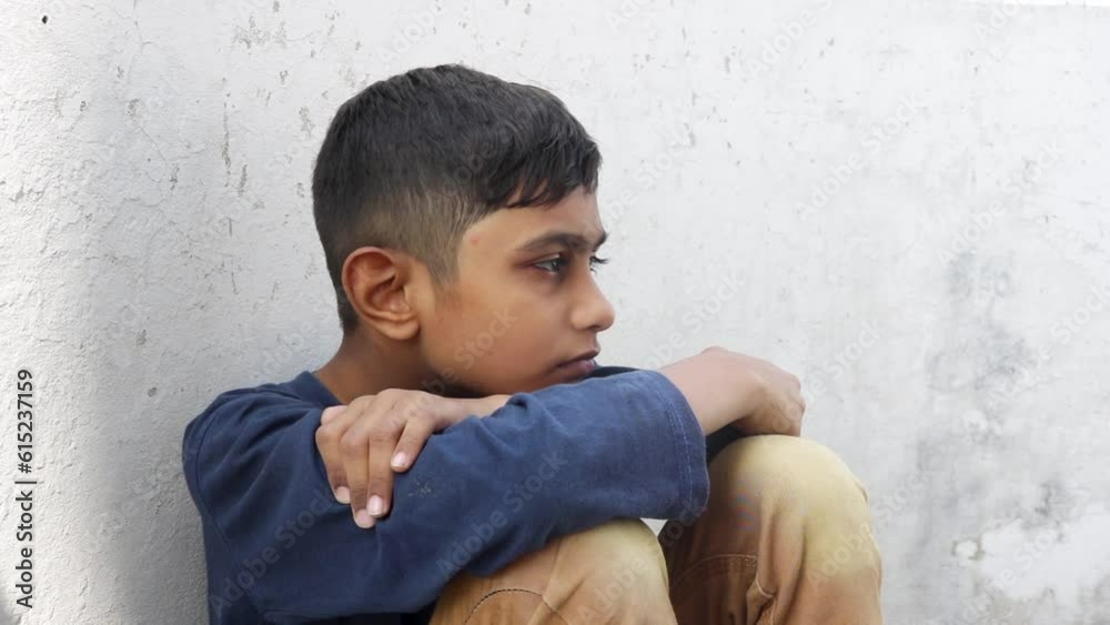 Young afro boy sitting alone with sad feeling. School Bullying ...