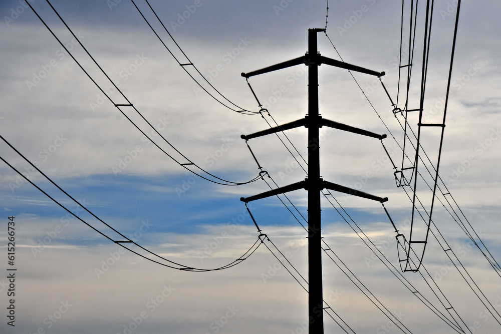 Three tiers of bundled lines with spacers on each side of tower. The ...