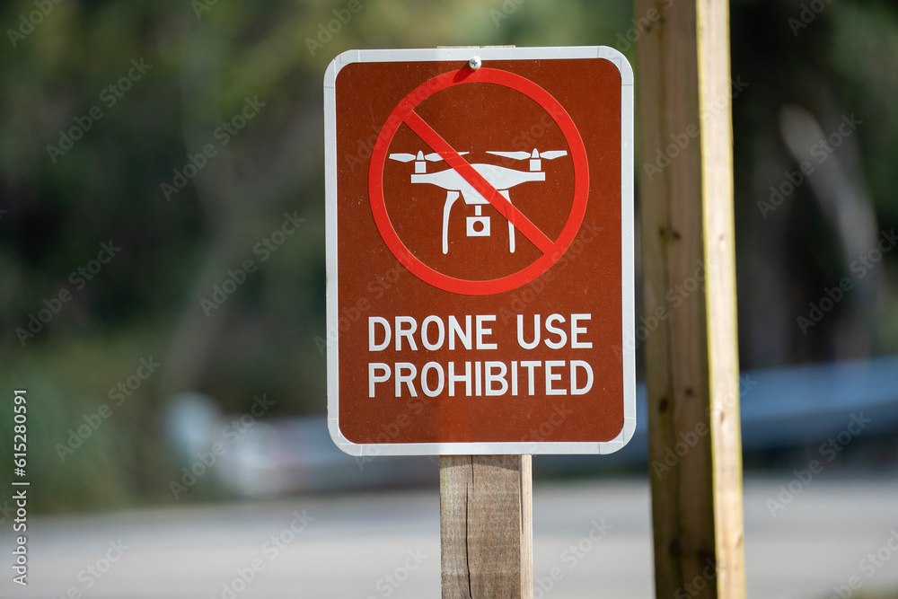 Signpost with warning about drone usage prohibition in state park ...