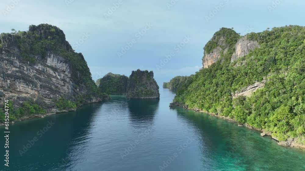 Dramatic limestone islands, eroded over millions of years, rise from ...