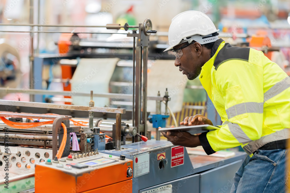 At the industrial plant, the diligent American male engineer, in a ...
