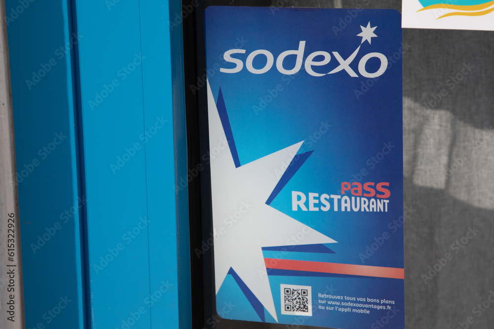 Sodexo brand logo and text sign label front entrance of bar door window ...