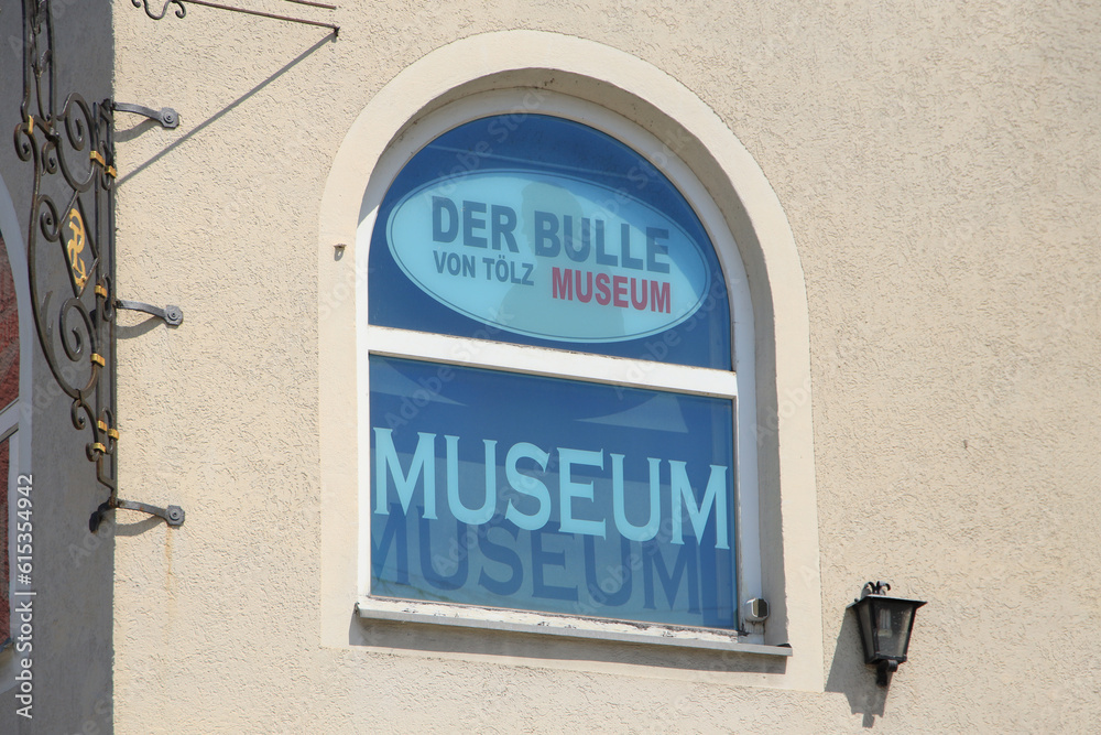 Window with lettering logo of "Der Bulle von Tölz" (Cop of Toelz) on a ...