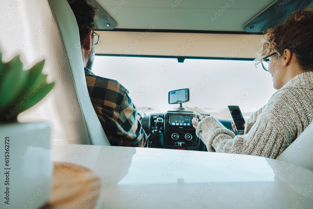 Inside back view of vehicle cabin like motorhome and couple traveling ...