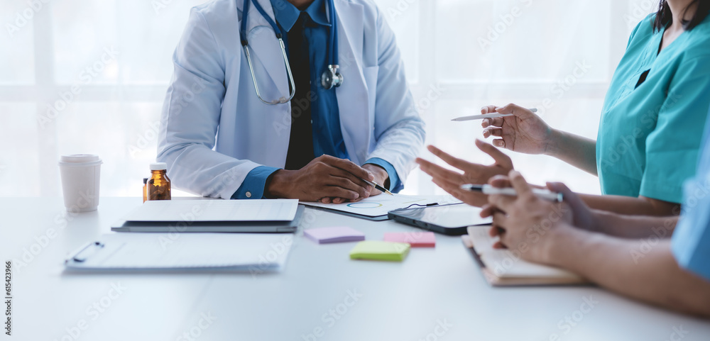 Successful medical doctors discussing diagnosis during the meeting ...