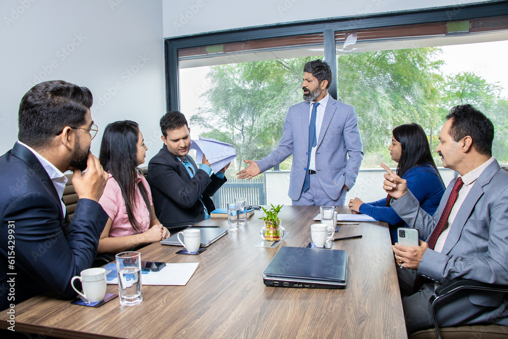 Angry indian boss screaming at male employee for bad work, Businessman ...