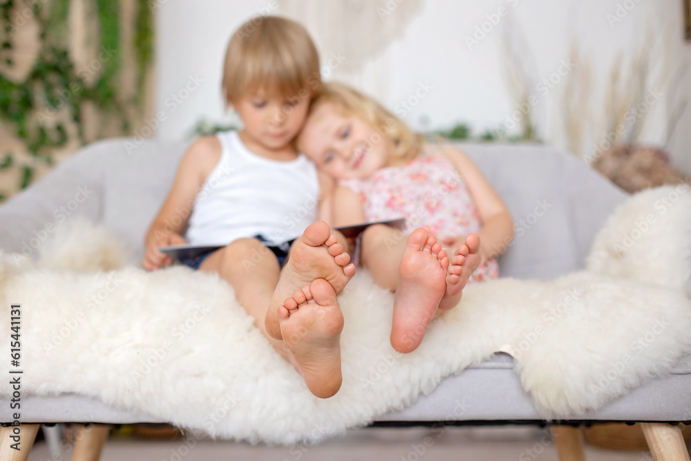 Cute sweet toddler children, tickling feet on the bed, laughing and smiling Stock Photo | Adobe ...