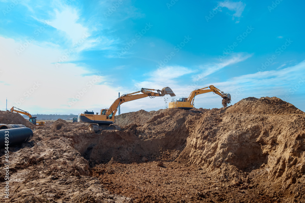 Two Excavator are digging soil in the construction site on sky ...