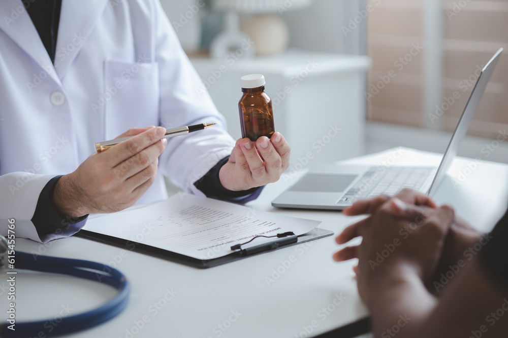 Doctor are recommending medicines to patients after being examined and ...