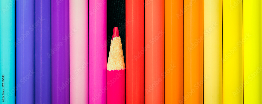 Pencil crayons in vibrant colors in a row; Studio Stock Photo | Adobe Stock