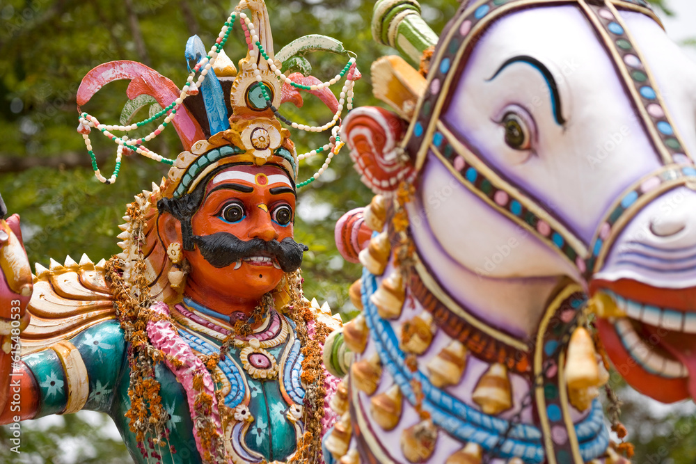 Ornate painted figure at a Hindu Temple in South India near Auroville ...