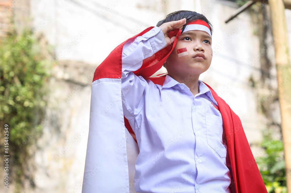 Indonesian elementary student wearing uniform and indonesian flag ...