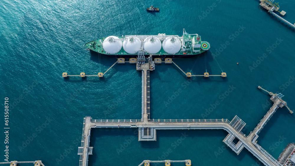 LNG (Liquified Natural Gas) tanker anchored in Gas terminal gas tanks ...
