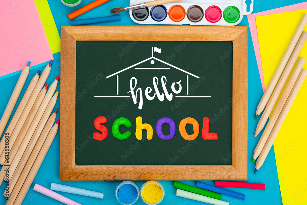 Hello school written on a framed blackboard. Top view flat lay concept ...