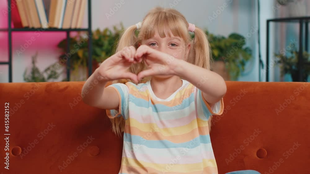 Stockvideon I love you. Child kid girl makes symbol of love, showing ...