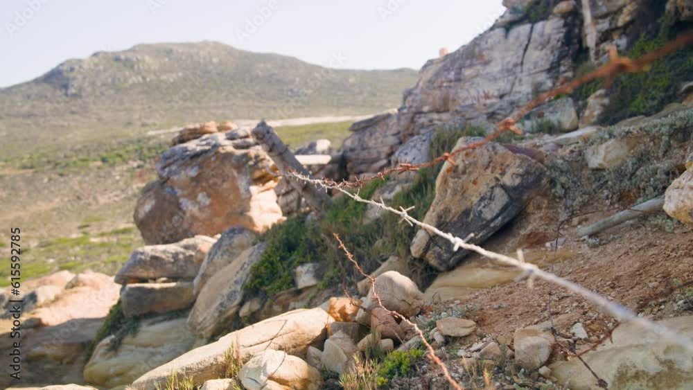 Barbed wire fence outdoors with focus rack and movement outdoors with ...