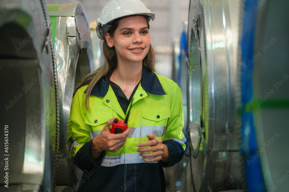 engineer woman standing with confidence with green working suite dress ...