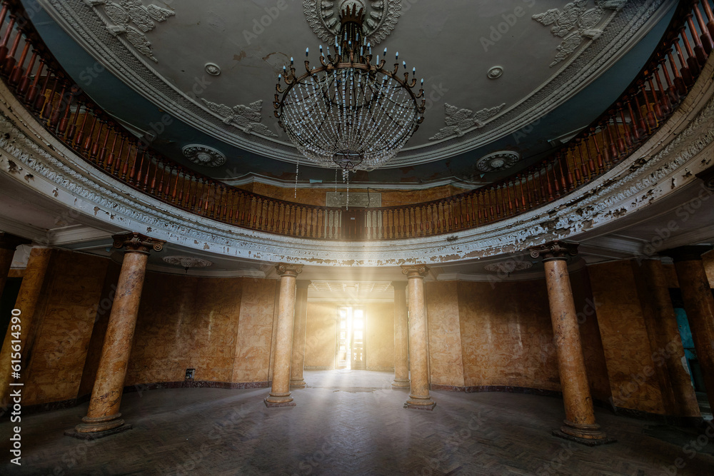 Entrance round hall with chandelier at the abandoned palace. Former ...
