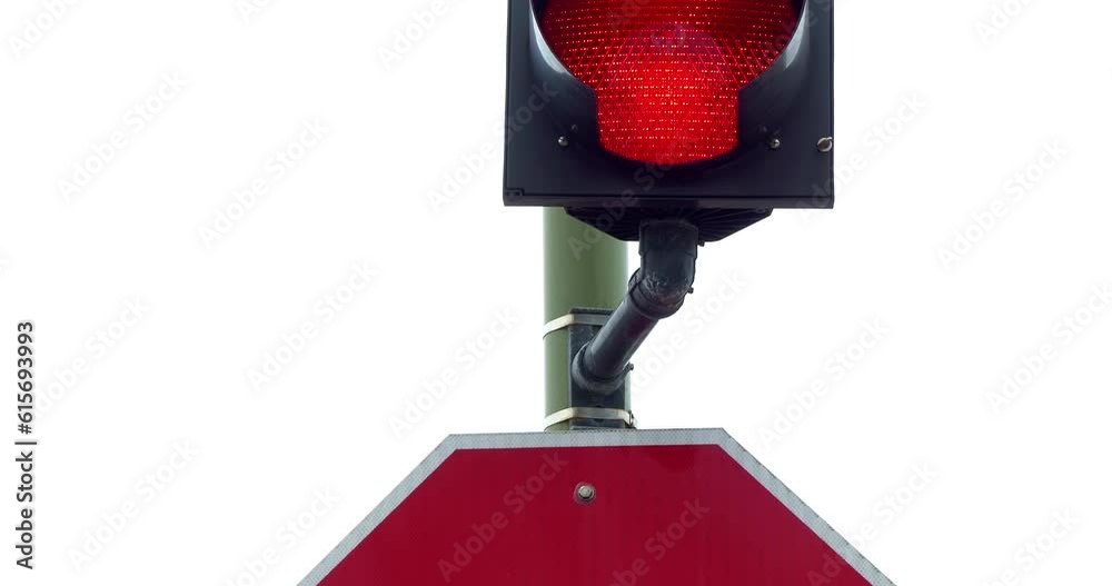 Stop sign and solar panel traffic light flashing on pole controlling ...