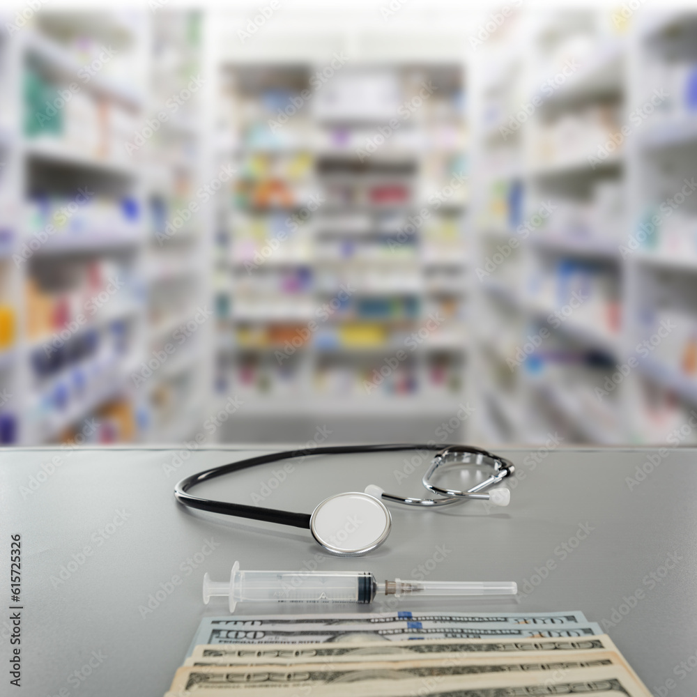 Stethoscope, syringe for injections and cash money on drugstore ...