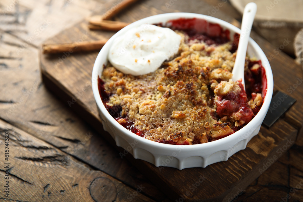Traditional homemade berry crumble with cream Stock Photo | Adobe Stock