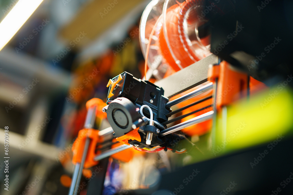 3d printer head. Card from below. Spool with filament in the background ...