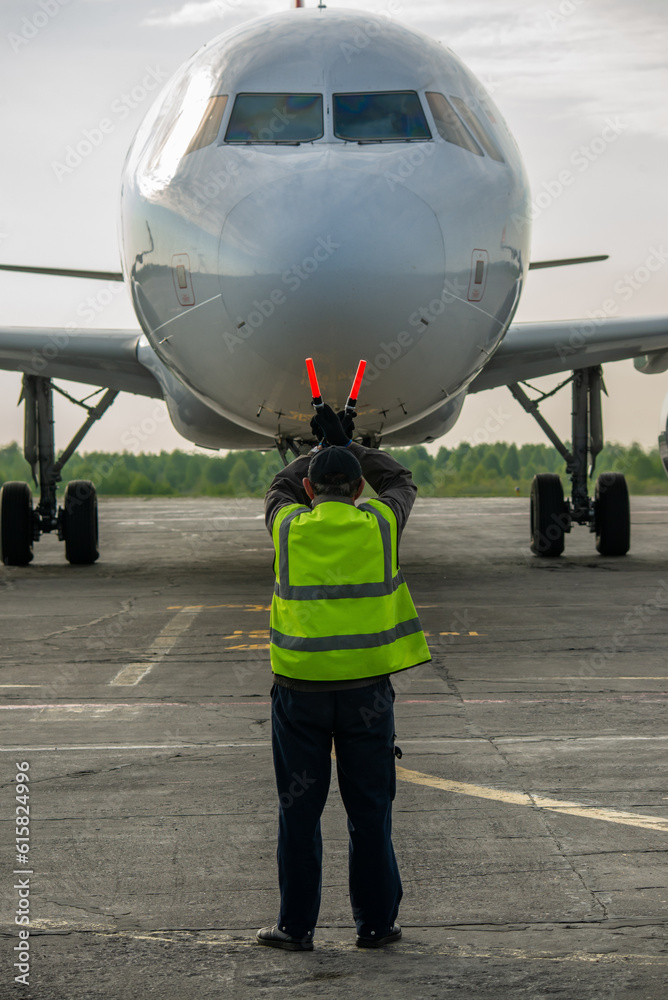 Ground Crew in the signal vest. Aviation Marshall Supervisor meets ...