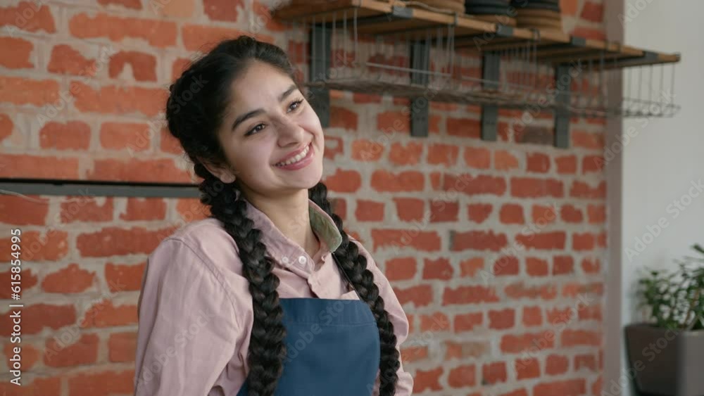 Smiling arabian woman barista waitress bar owner give order behind ...
