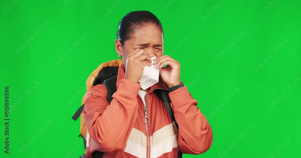 Sneeze, sick hiker and woman on green screen in studio isolated on a ...