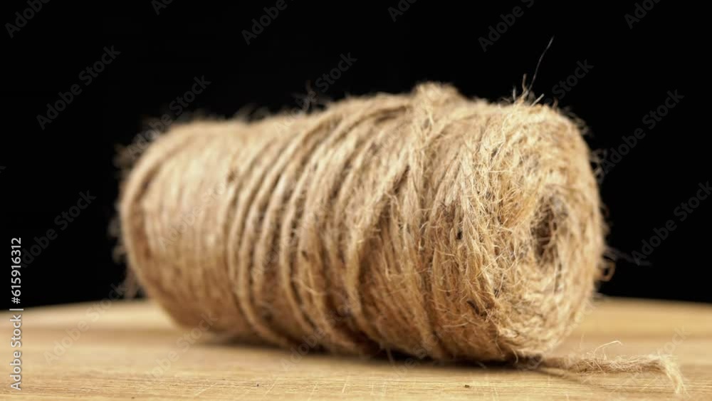 Close up, Spool of Hemp Twine Rotation on a Wooden Board, Black ...