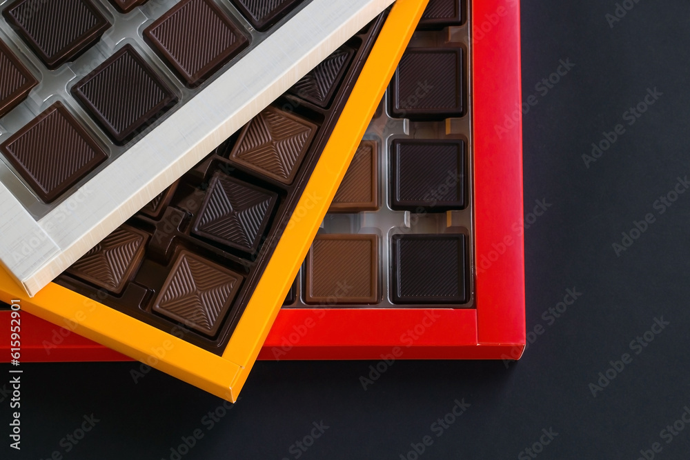 Milky and bitter square shape chocolate Madlen,designed in box on black ...