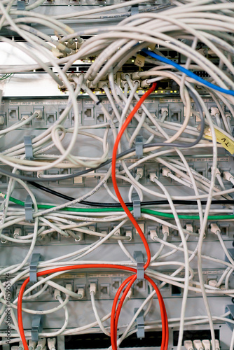 a bunch of patch network cables sorted in a rack cabinet leading from a ... a bunch of patch network cables sorted in a rack cabinet leading from a ...