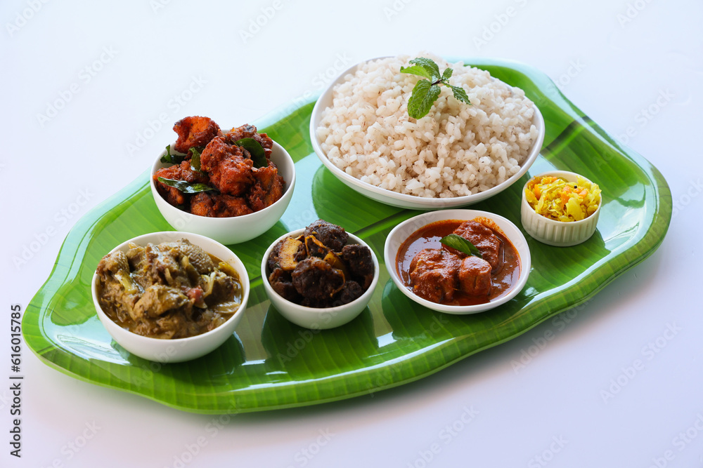 Kerala special food sadhya in banana leaf plate with Chicken fry Duck ...