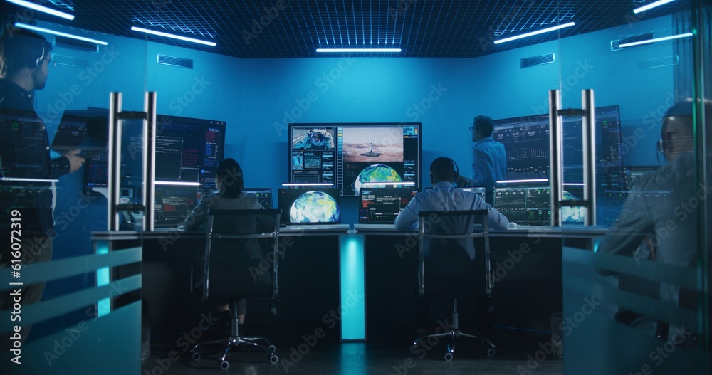 Team watch successful space rocket launch on big digital screens in ...