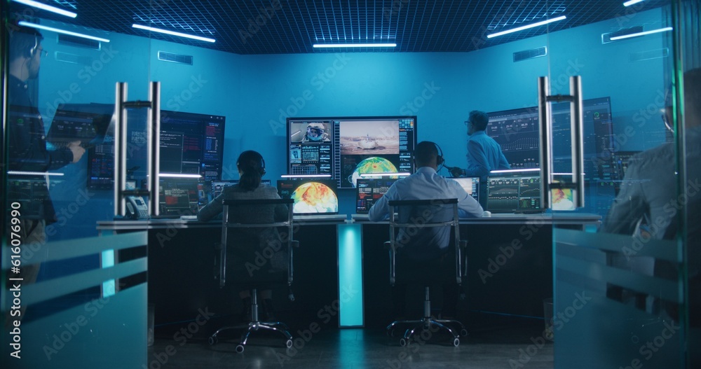 Team watch successful space rocket launch on big digital screens in ...