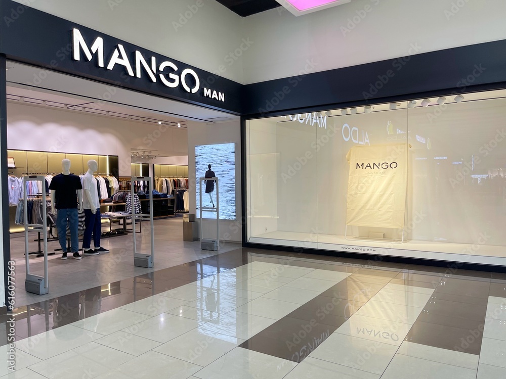 Mango shop in shopping mall. Men's section. Sign Mango Man. Famous ...
