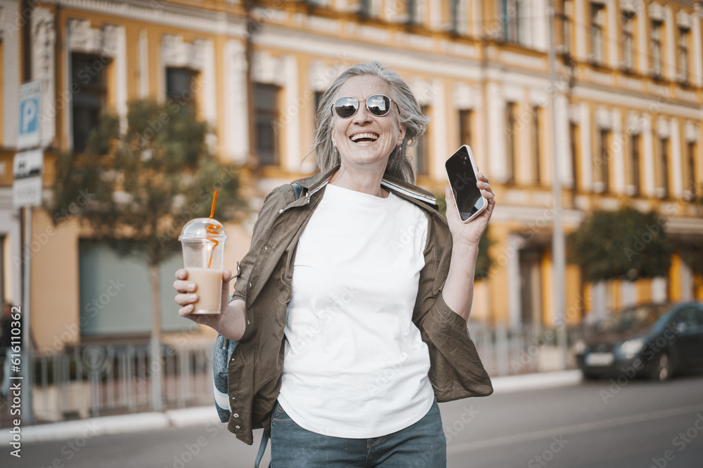 Happy senior old woman smiling outdoors. She speaking on phone ... Happy senior old woman smiling outdoors. She speaking on phone ...
