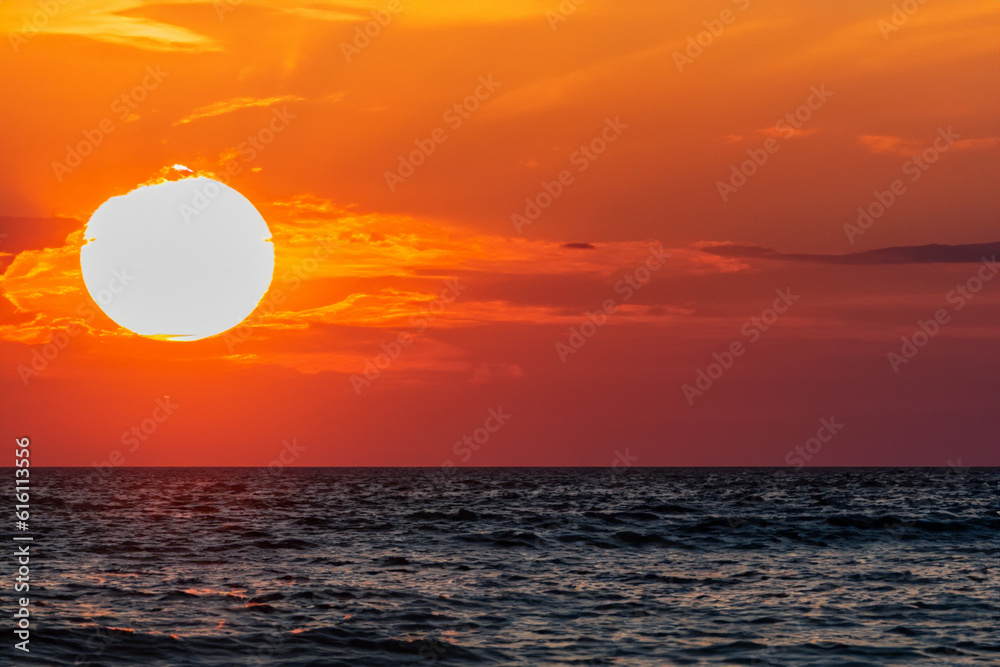 Fiery sunsets over the ocean- Watch as the sun sets over the ocean ...