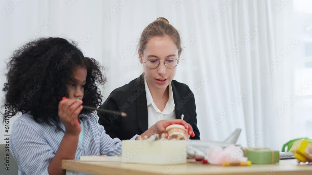 Teacher Guiding Students in the Art of Teeth Cleaning. African American ...
