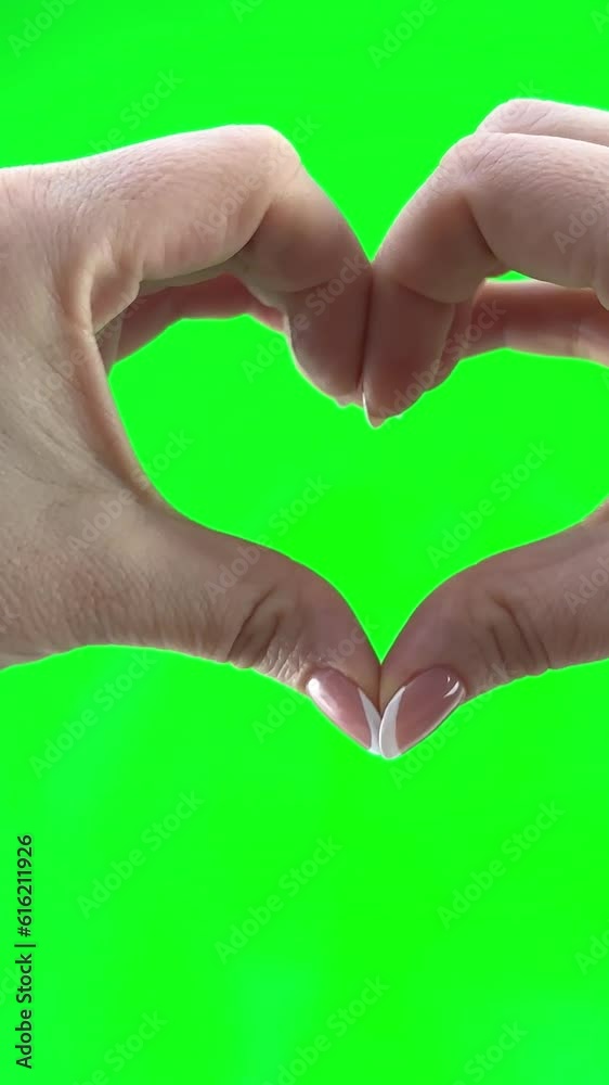 A hand heart. Person forms a heart shape using their fingers. Two ...