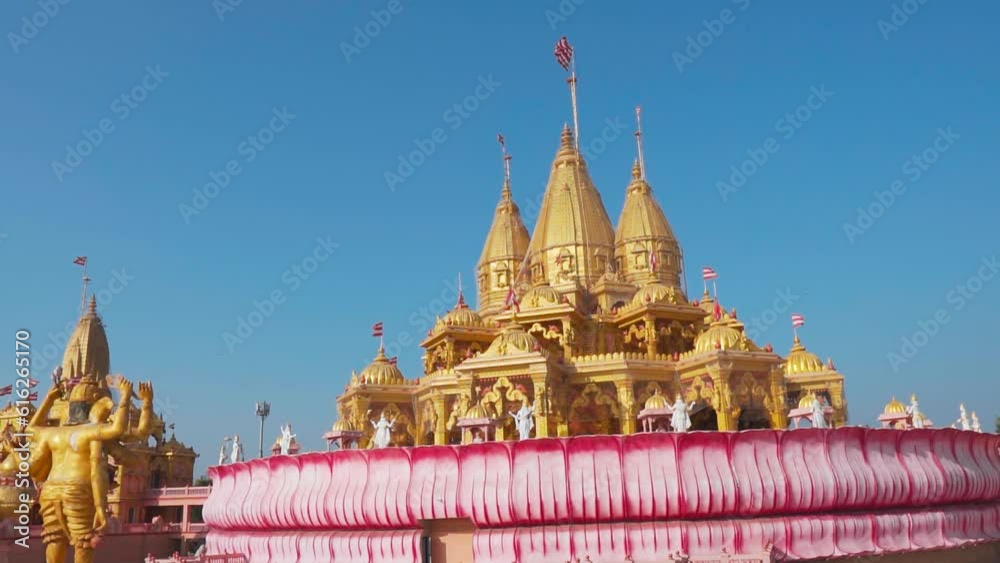 Wide angle shot of beautiful golden Swaminarayan temple of ...