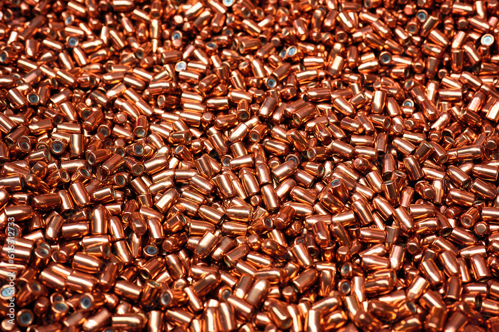 Sparkling golden bullets heap for firearms as background Stock Photo ...