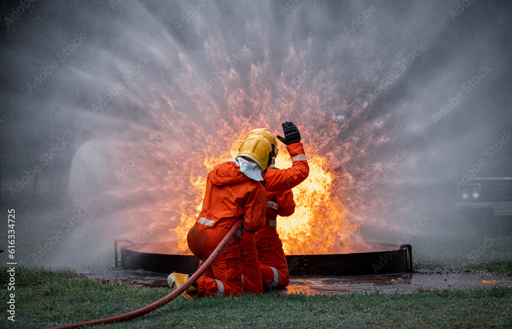 Firefighters safety using twirl water fog type fire extinguisher to ...