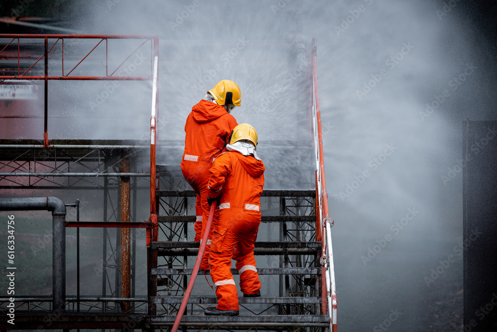 Firefighters safety using twirl water fog type fire extinguisher to ...