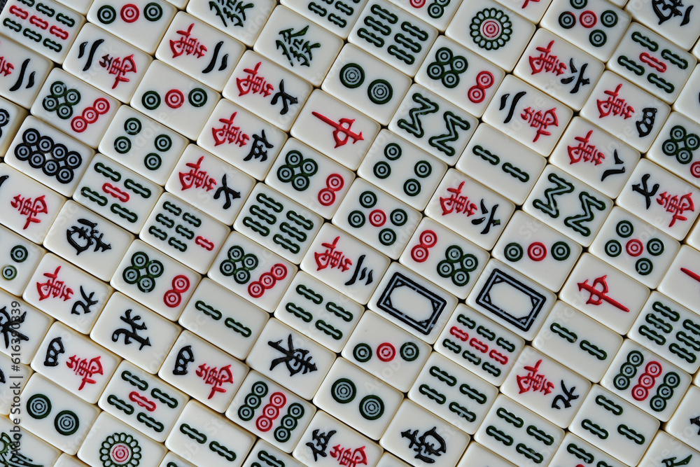 top down view of many Chinese mahjong tiles background. Traditional ...
