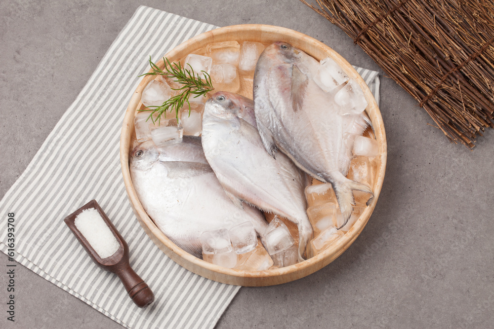 A saltwater fish of the Byeongguidae family. A flat, round fish with a ...