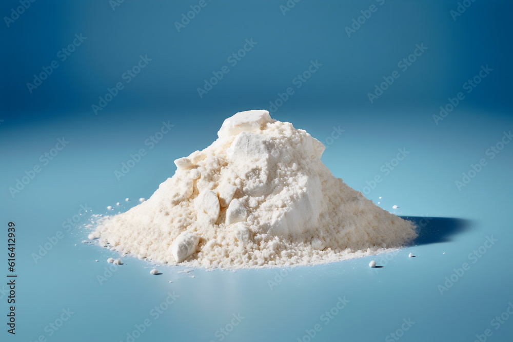 pile of white powder isolated on blue plain studio background made with ...