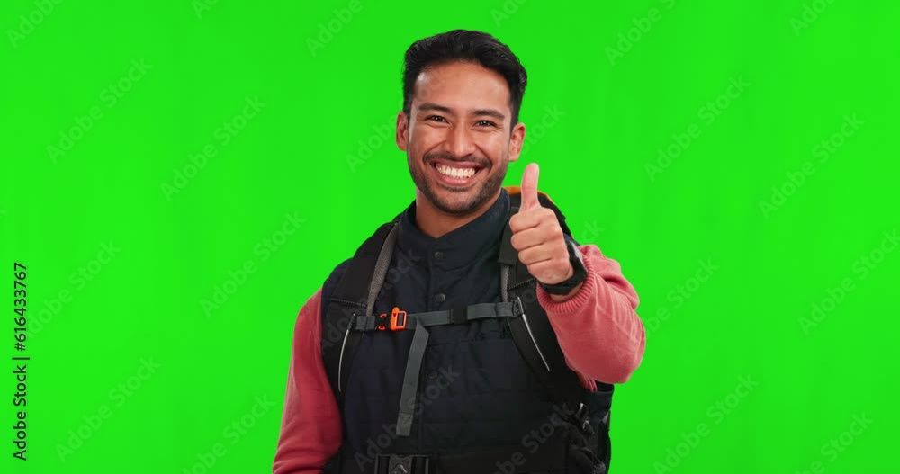 Asian man, hiker and thumbs up on green screen for travel, adventure or ...