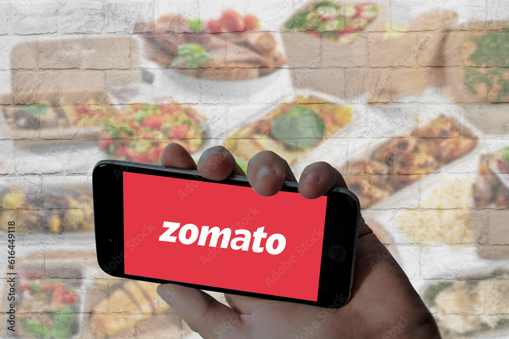 CHENNAI, INDIA 27TH JUNE 2023: Zomato logo in holding mobile and ...