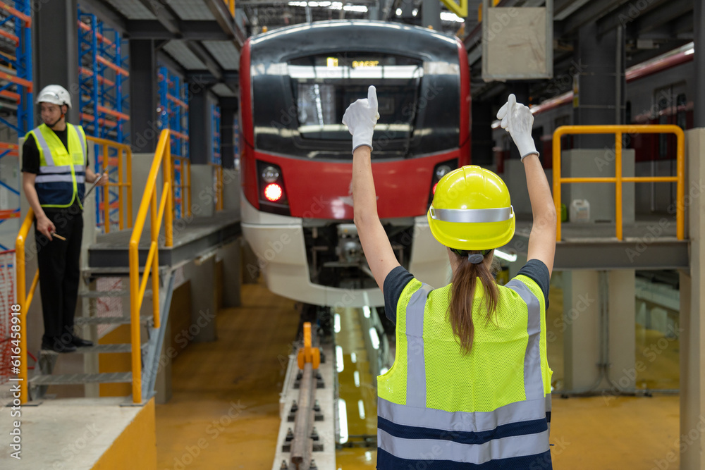 Posture giving the electric train signal to the train conductor in the ...